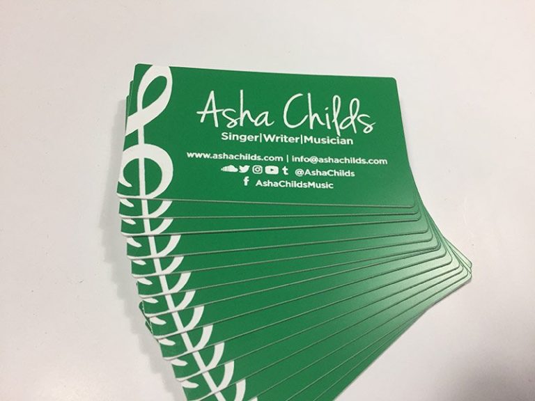 Green plastic business card laser cut to white - Digital Skratch